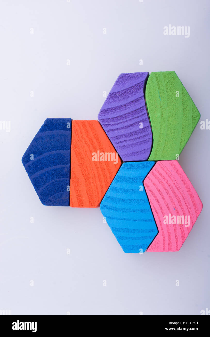 Colorful wooden pieces of a logic puzzle Stock Photo - Alamy