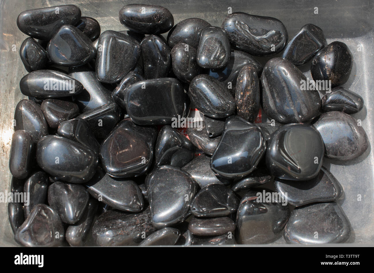 Shiny metallic gray tumbled hematite gemstone as mineral rock Stock ...