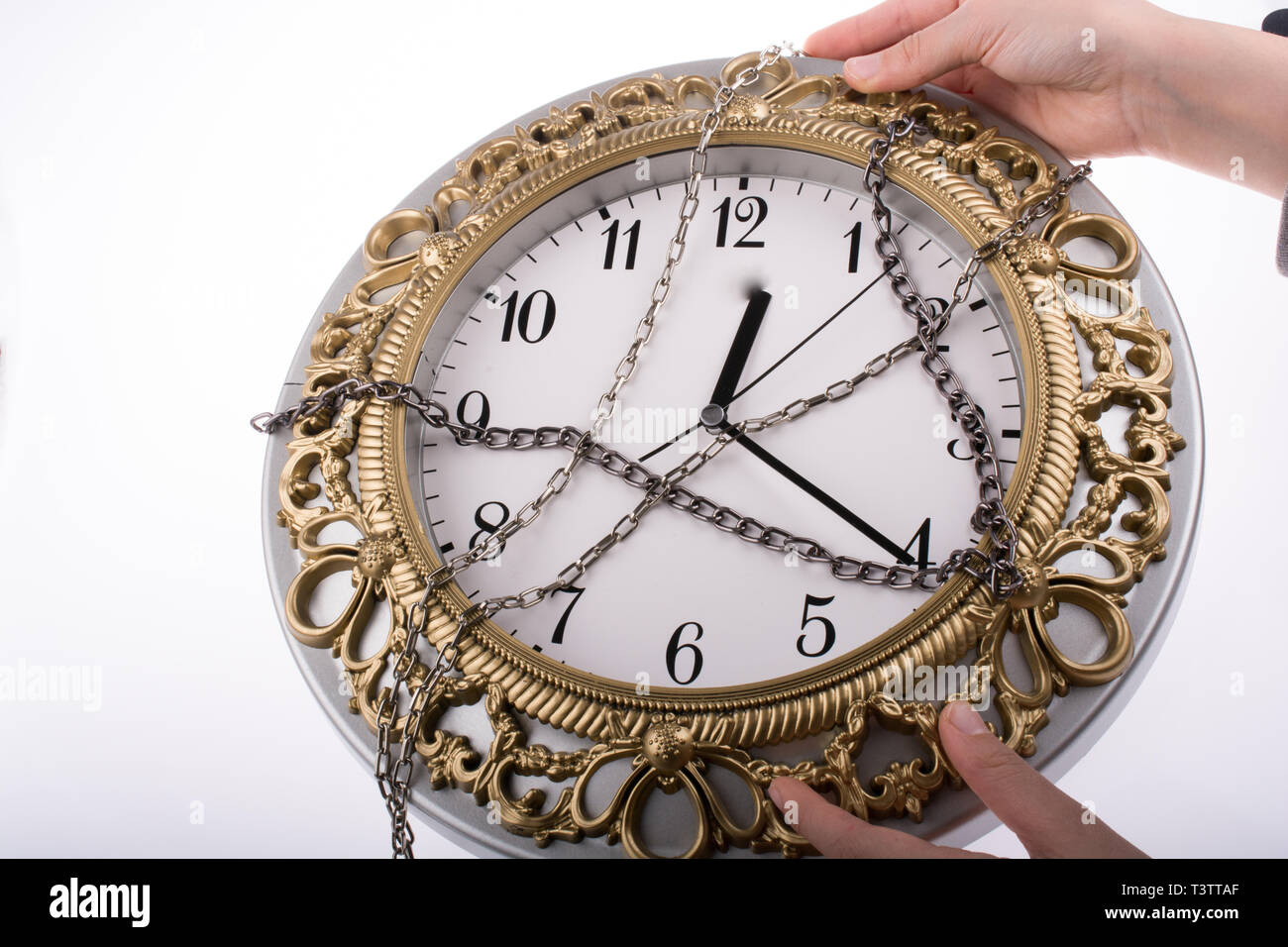 chained clock on a white background Stock Photo - Alamy