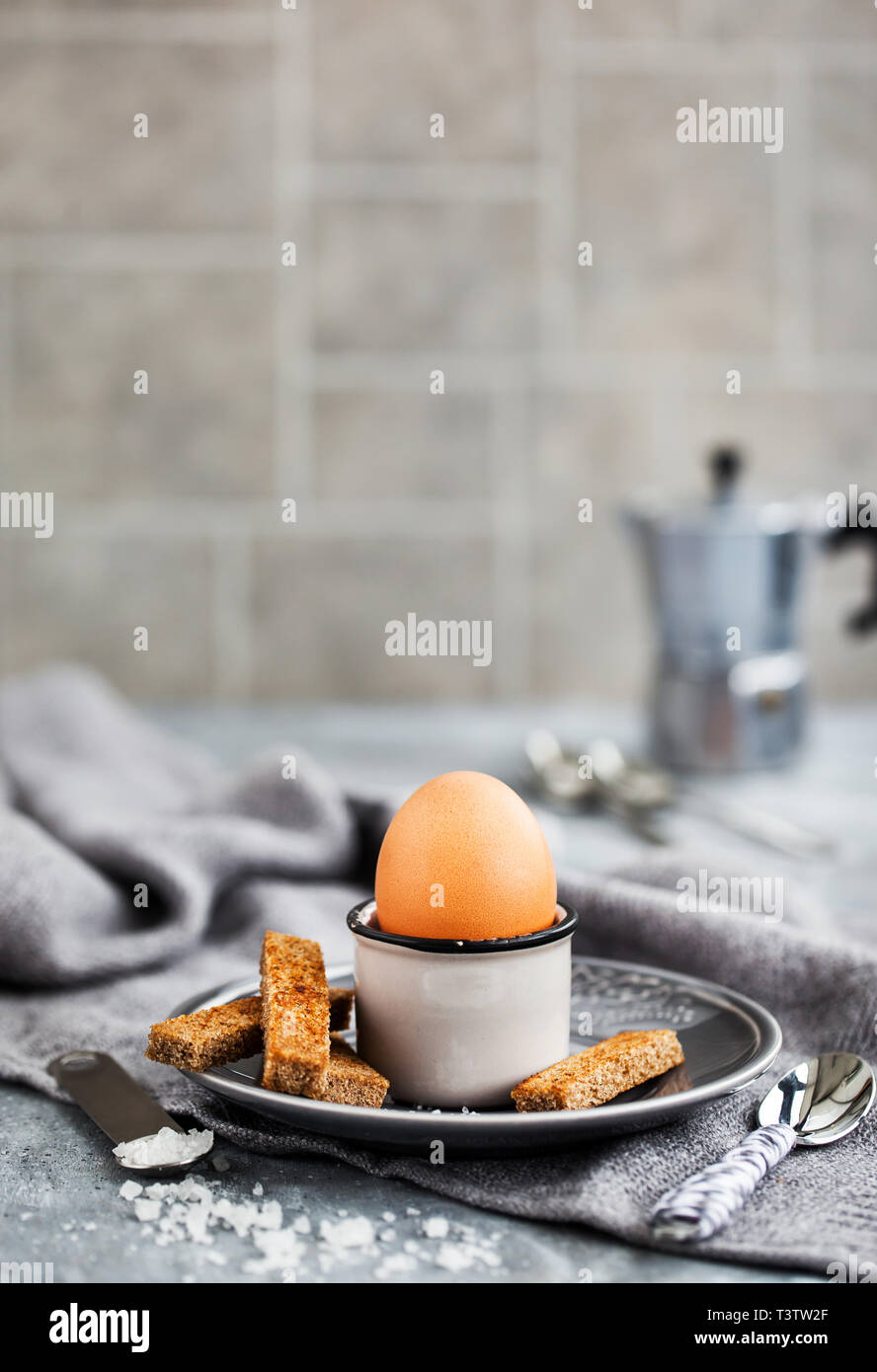 Boiled egg with rye toasts for breakfast Stock Photo - Alamy