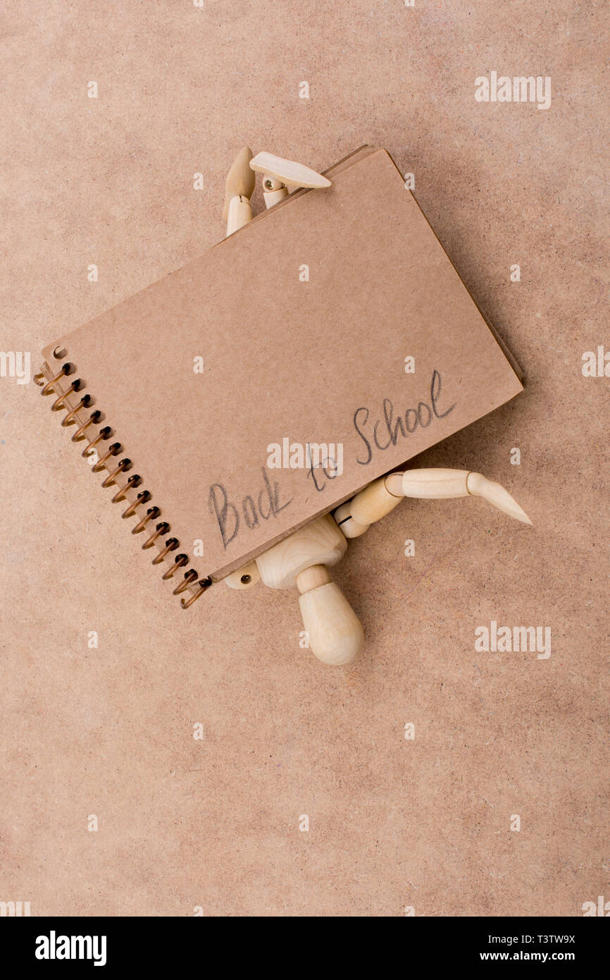 Back to school lettering on a notebook in arm Stock Photo - Alamy