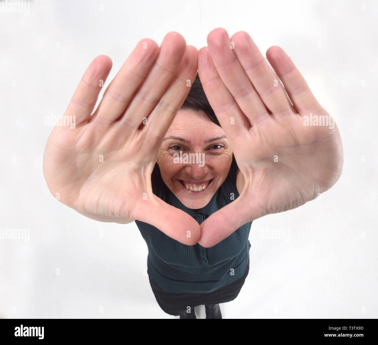 woman two hands up on black background Stock Photo - Alamy