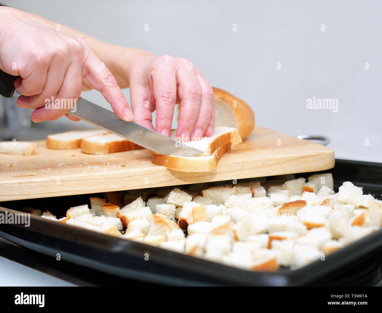 Female hands with knife preparing bread crumbs, studio close-up Stock ...