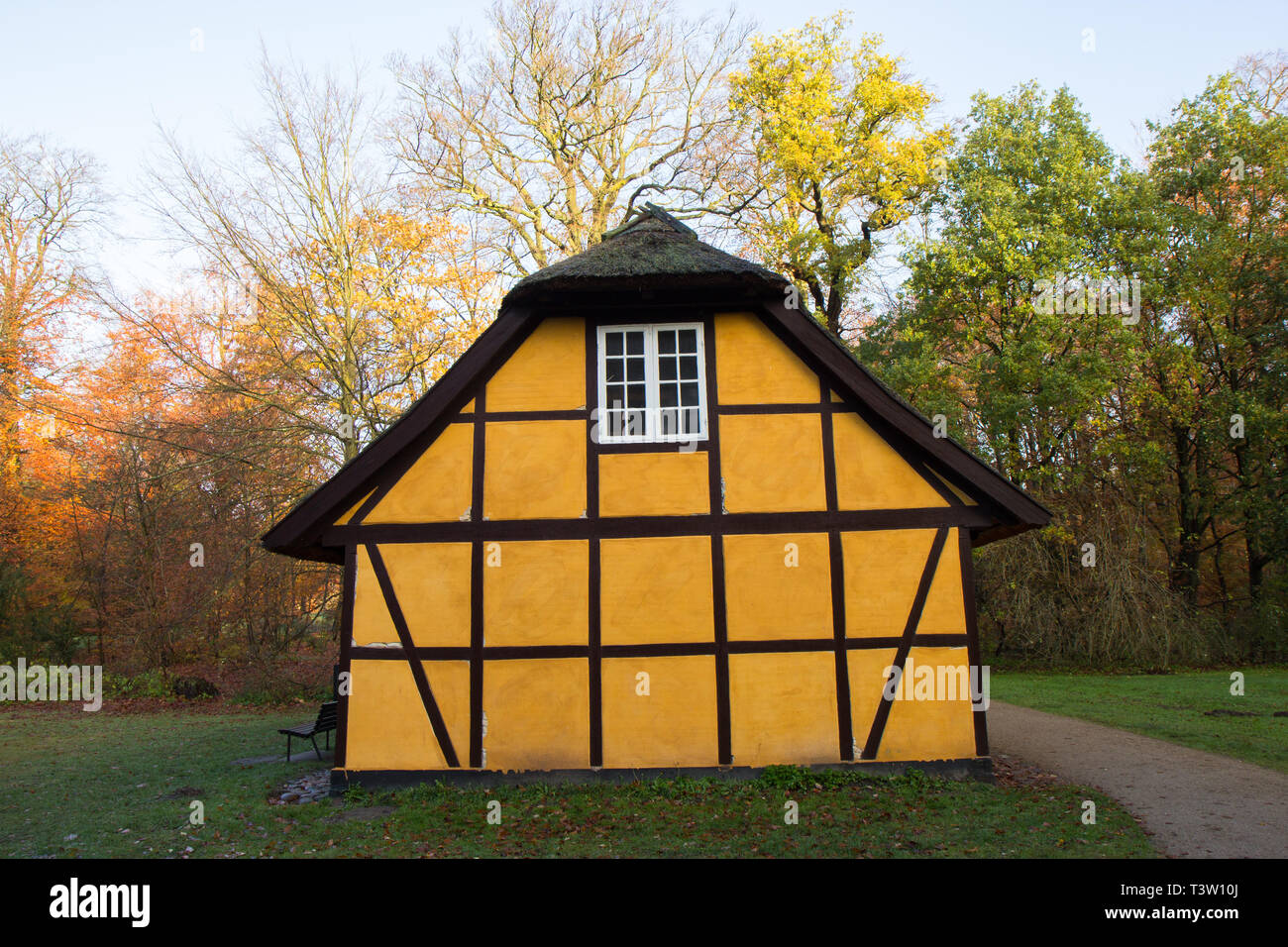 Old yellow half timbered house with thatched roof in Charlottenlund ...