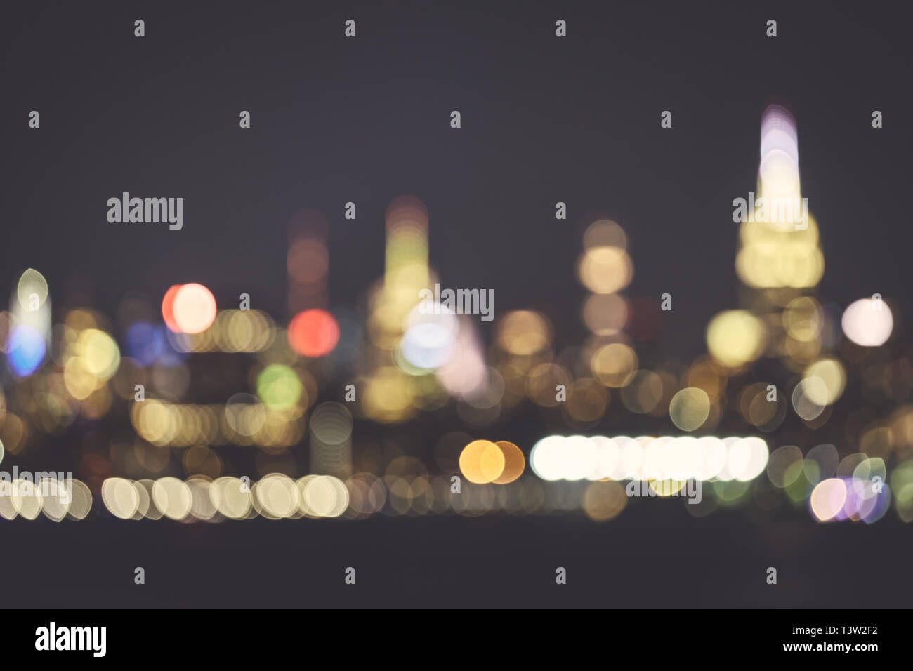Blurred New York City skyline at night, color toned urban background ...