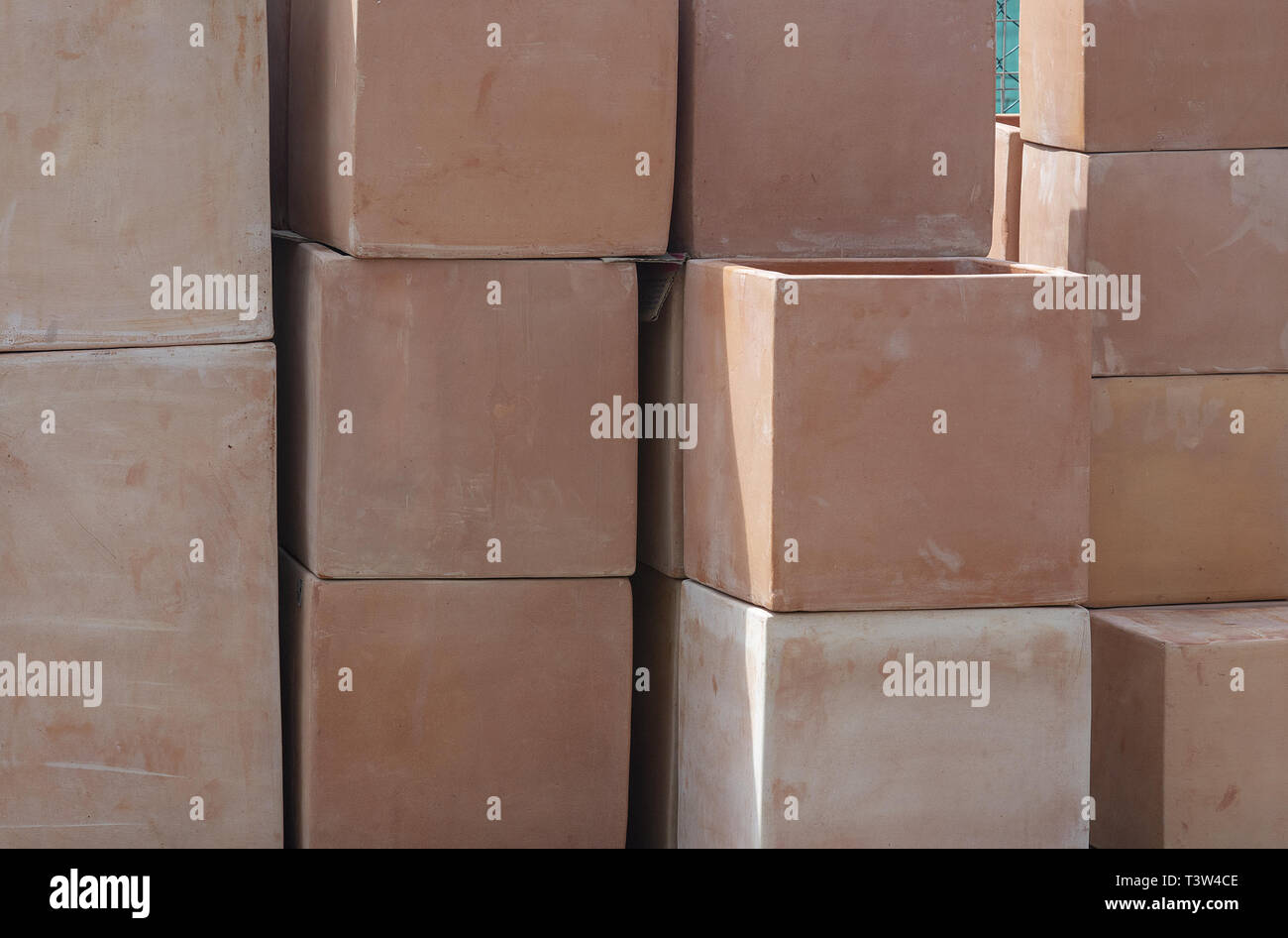Rustic terracotta pots cube shape piled up on display closeup full ...