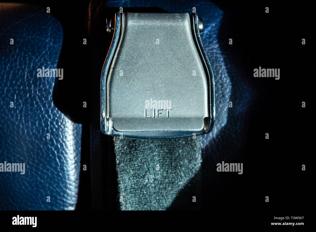 Safety lock of an airplane belt, isolated Stock Photo - Alamy