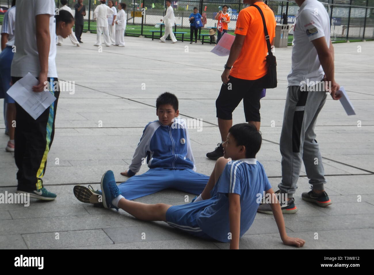 Shenzhen, China: middle school students take a break during the sports ...