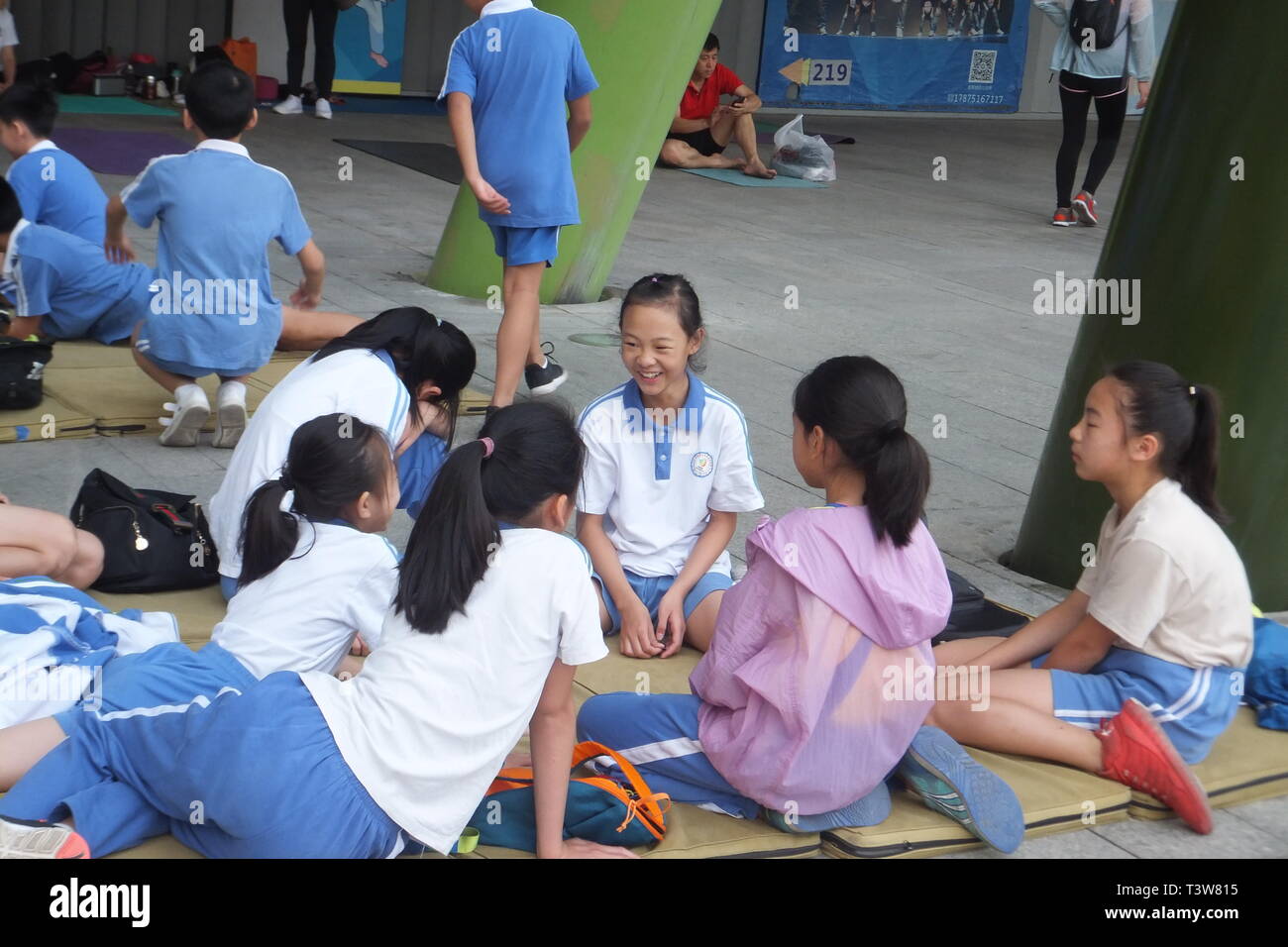 Shenzhen, China: middle school students take a break during the sports ...