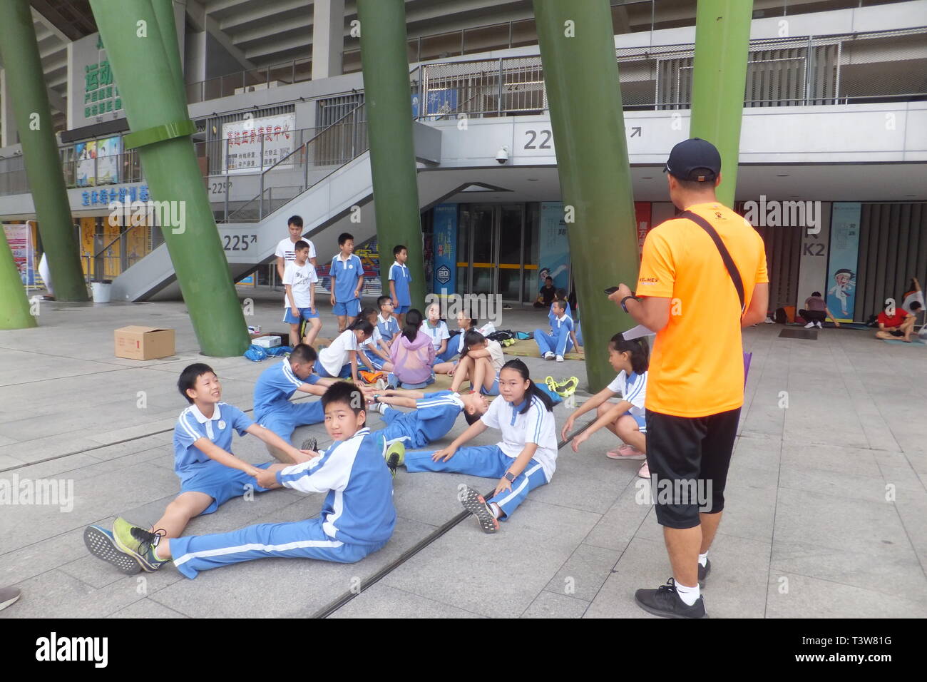 Shenzhen, China: middle school students take a break during the sports ...