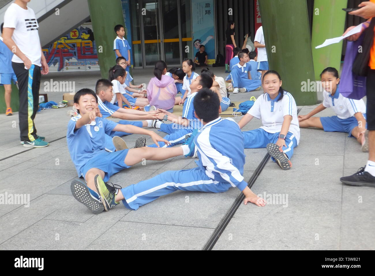 Shenzhen, China: middle school students take a break during the sports ...