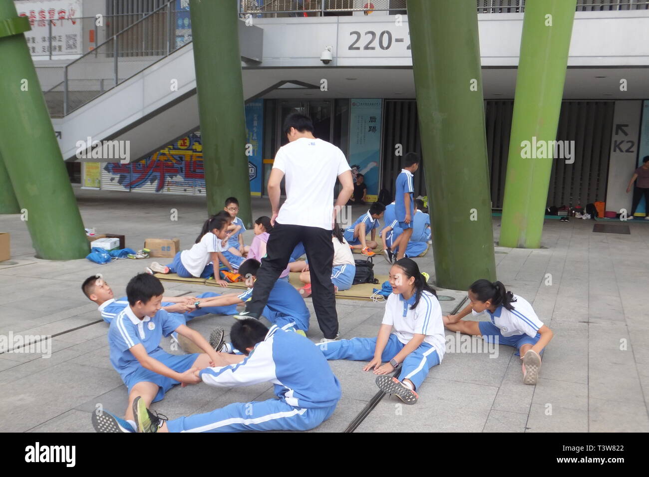 Shenzhen, China: middle school students take a break during the sports ...