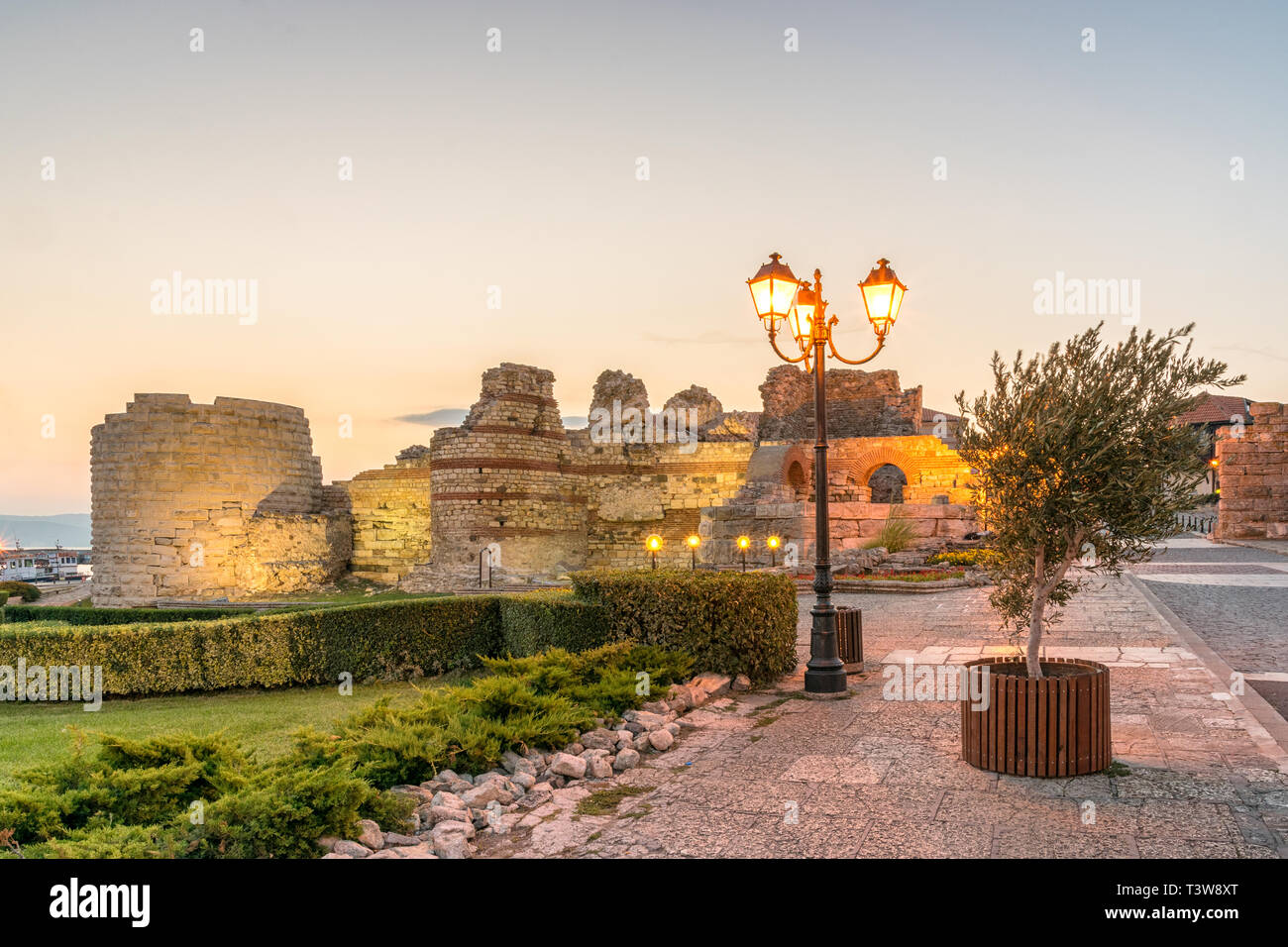 Ancient ruins at the entrance of the Nessebar ancient city at sunrise ...