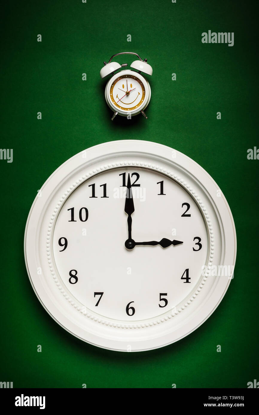 Two clocks on a wall hi-res stock photography and images - Alamy