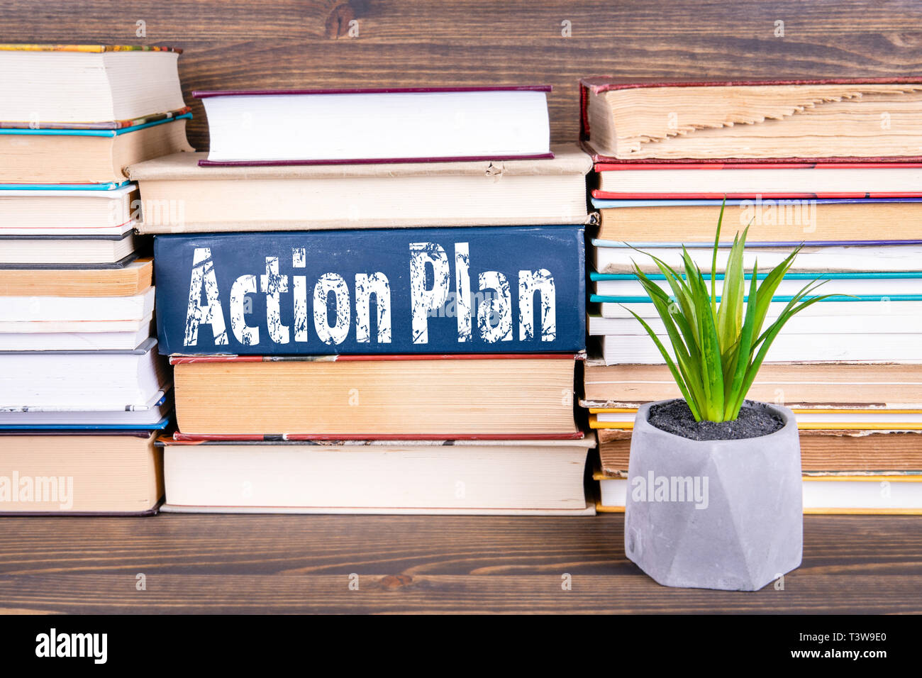Action Plan concept. Books stacked Stock Photo - Alamy