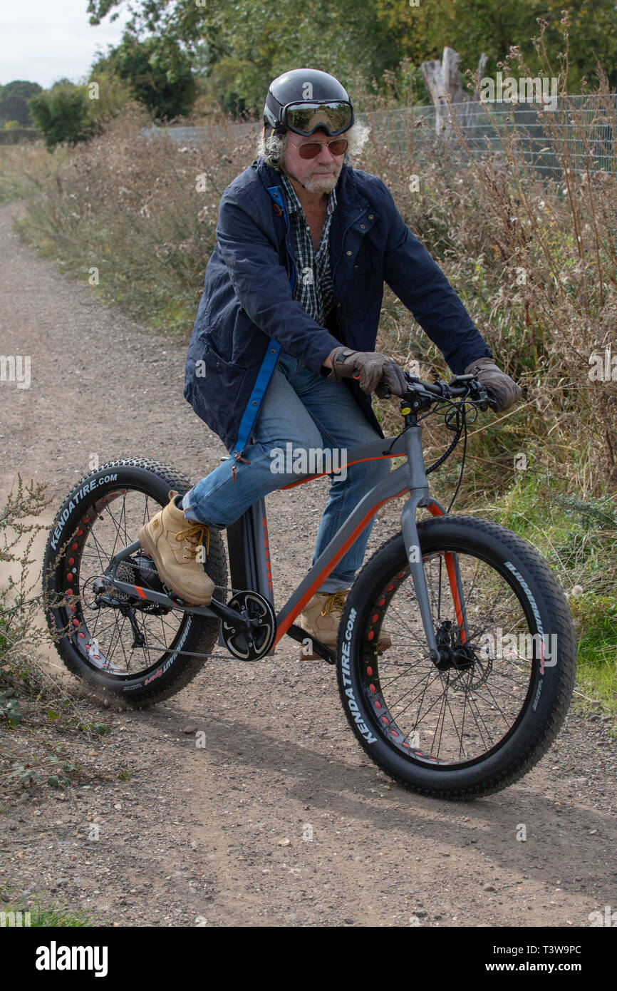 A man rides an electric bike UK Stock Photo - Alamy