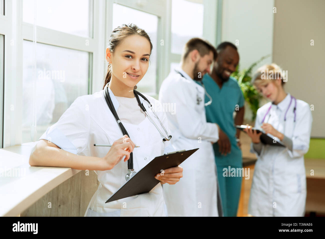 Healthcare people group. Professional female doctor posing at hospital ...