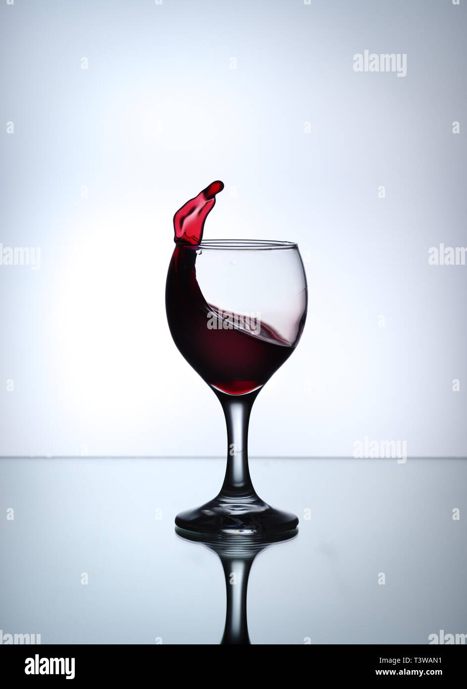 stream of wine being pouring into a glass closeup, wine, splashing ...