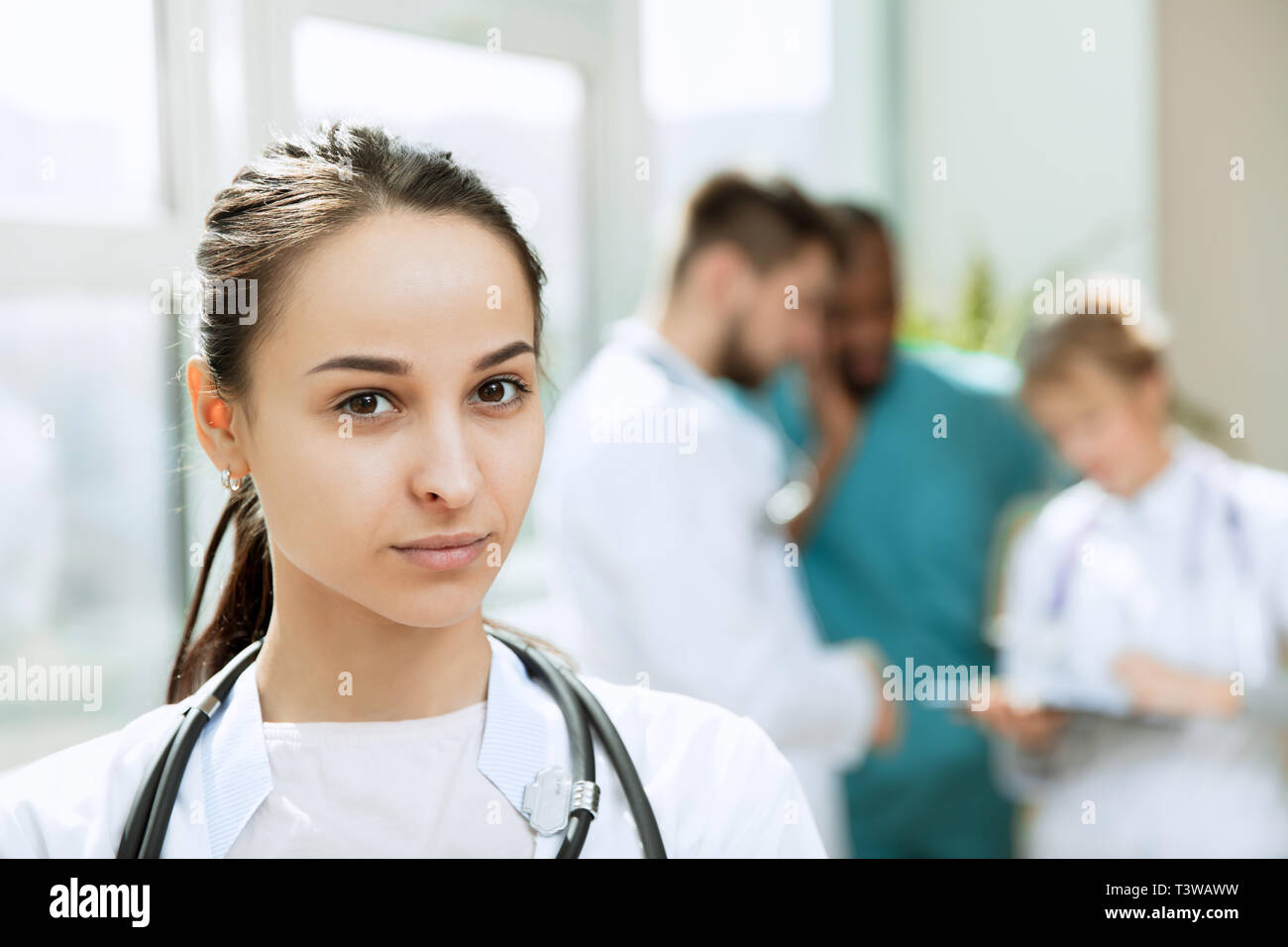 Healthcare people group. Professional female doctor posing at hospital ...