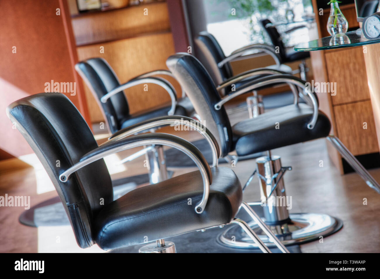 Chairs in empty beauty salon Stock Photo - Alamy