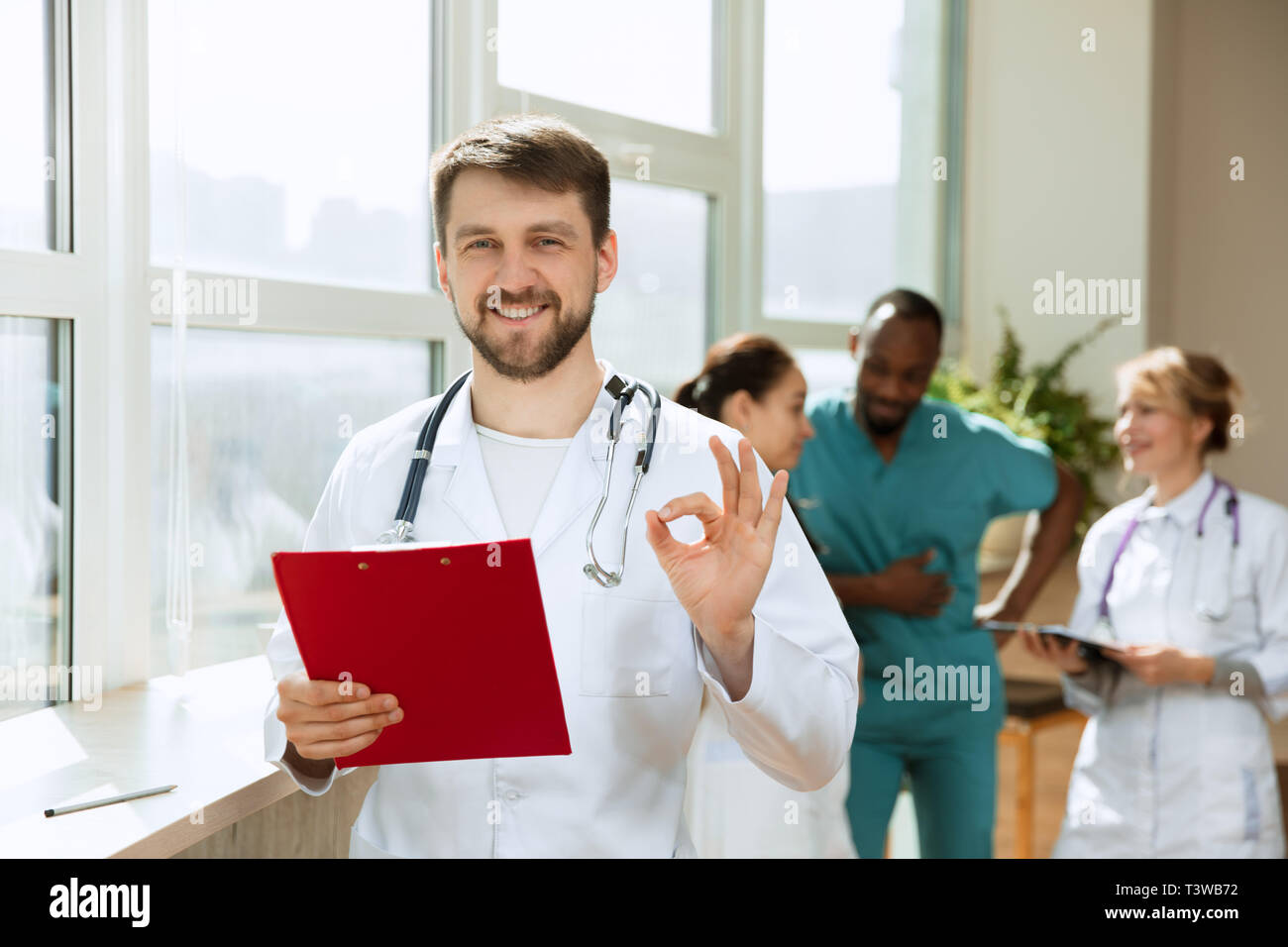 Healthcare people group. Professional male doctor posing at hospital ...
