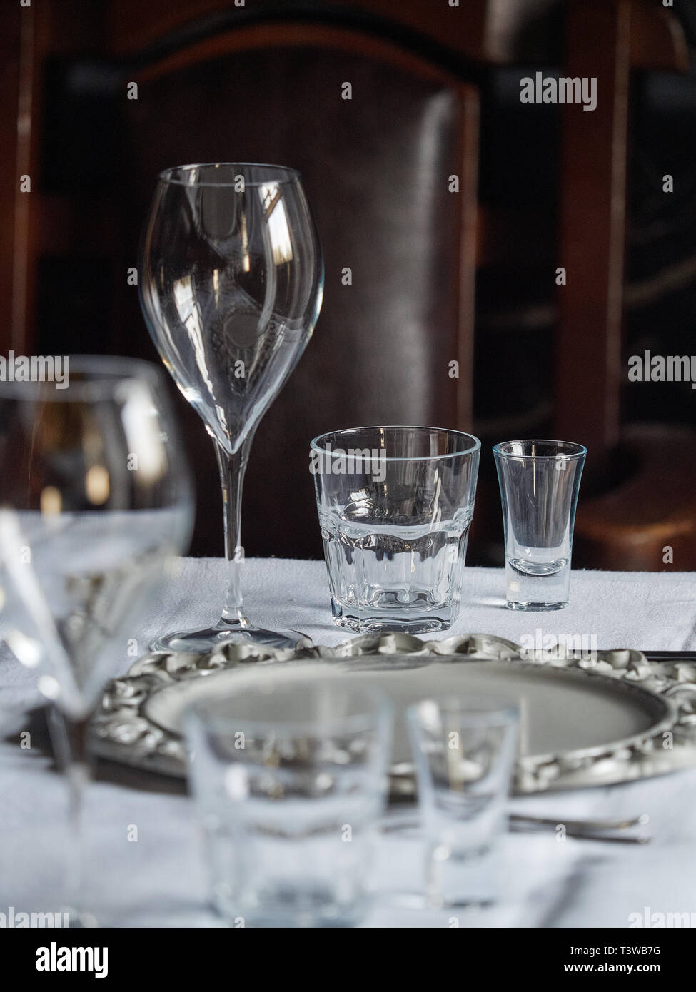 Various glass glasses are set on the table in the restaurant Stock ...