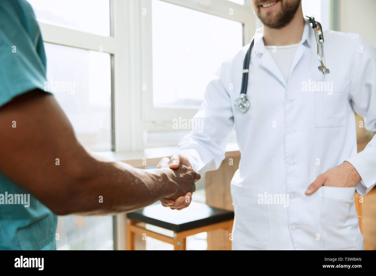 Deal. Concept of collaboration in medicine. Close up photo of two ...
