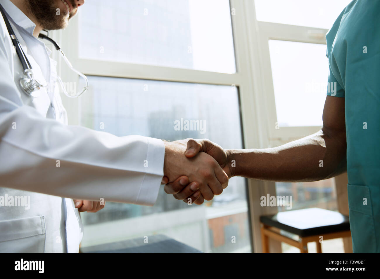 Deal. Concept of collaboration in medicine. Close up photo of two ...