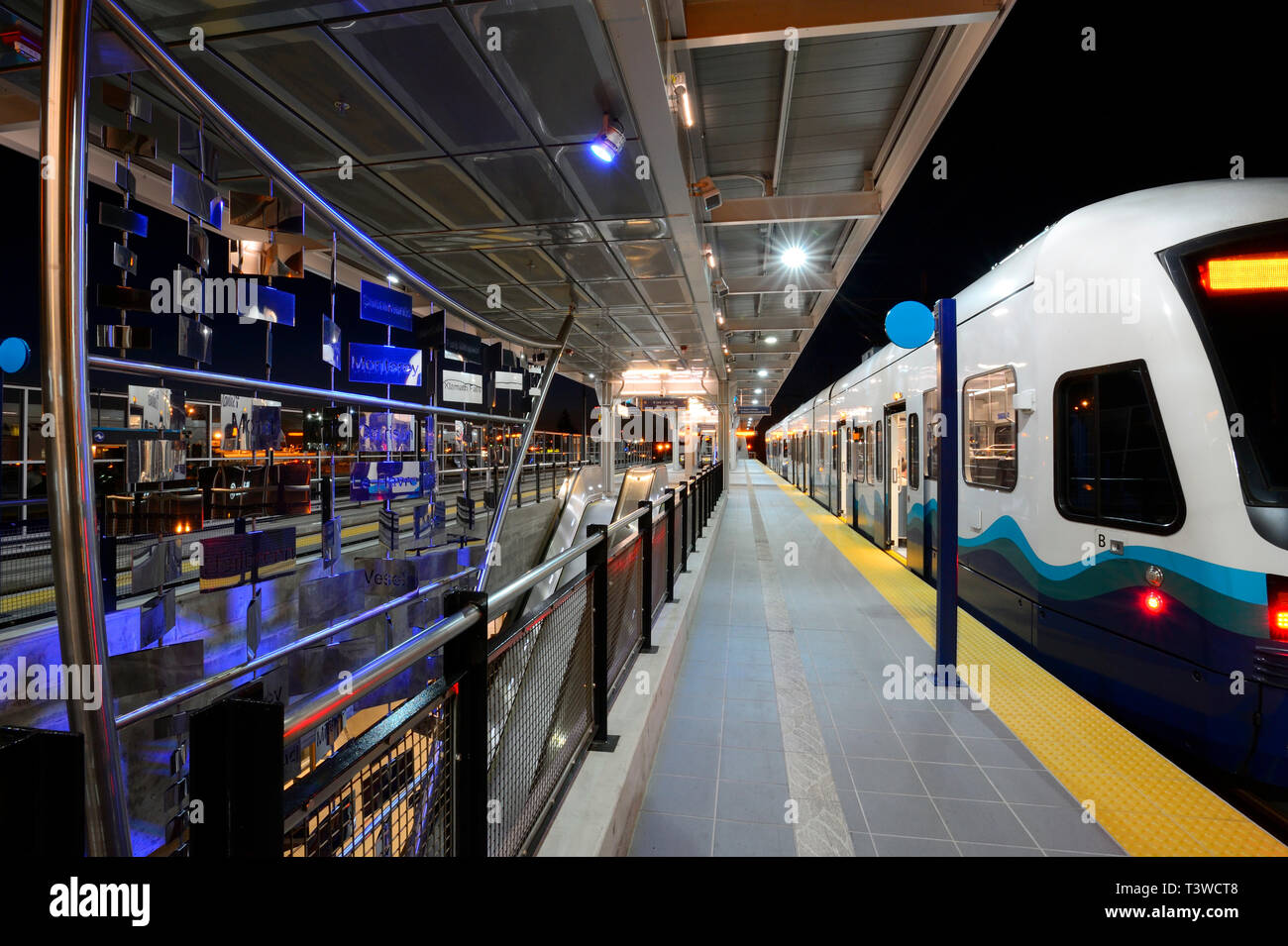 Light rail pulling into station Stock Photo - Alamy