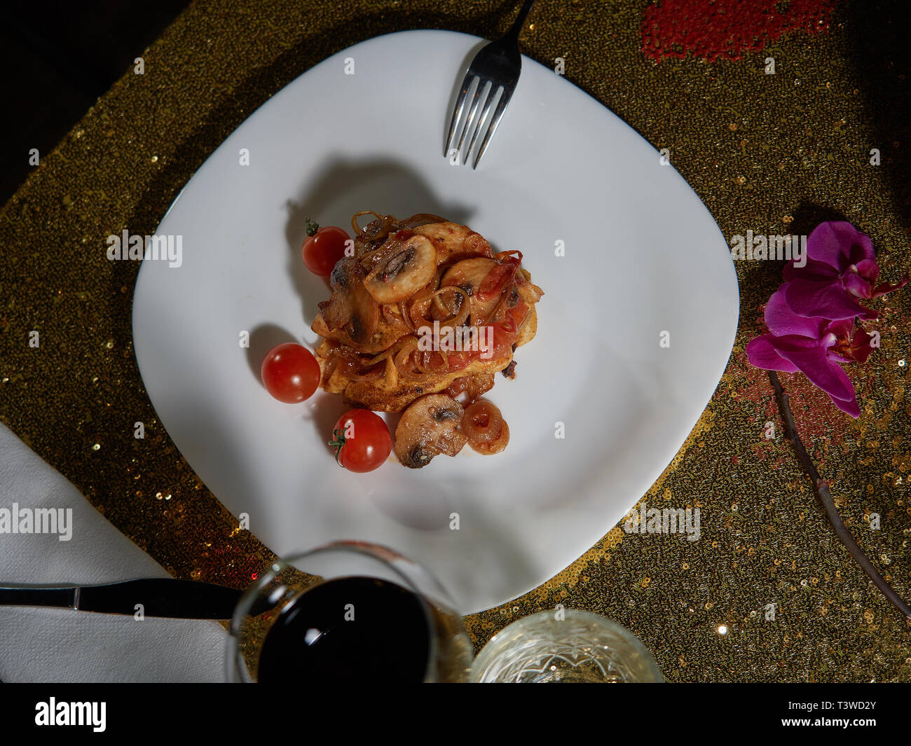 Small cuts of meat cooked along with fried mushrooms and onions are ...