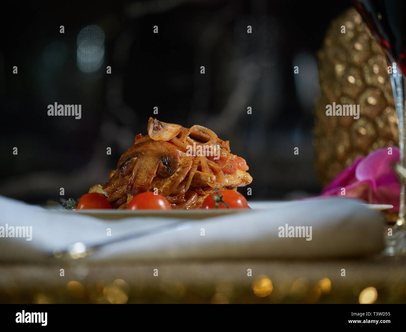Small cuts of meat cooked along with fried mushrooms and onions are ...