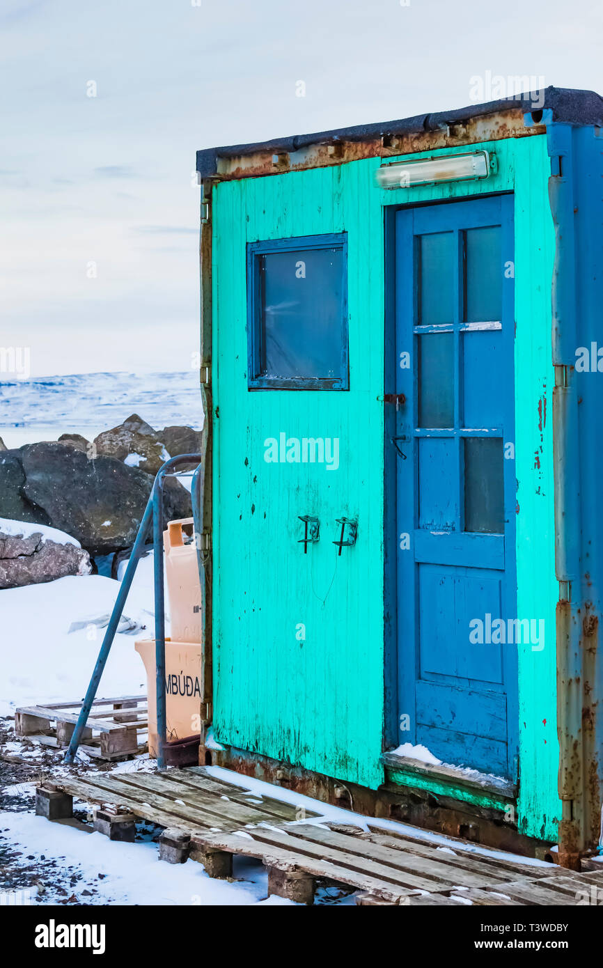 Colorful steel shipping container on the waterfront in Hólmavík are ...