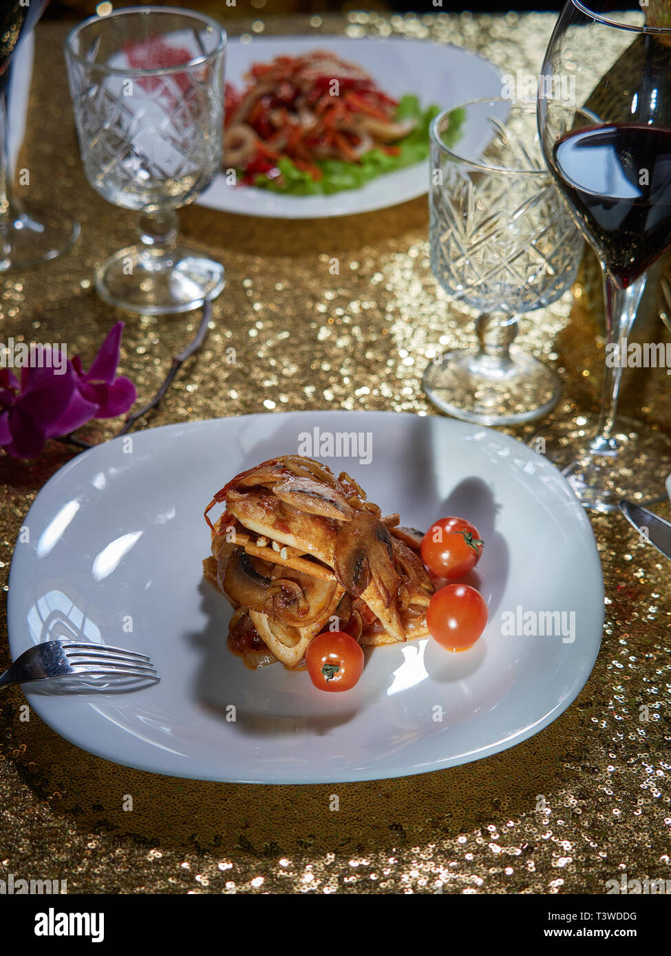 Small cuts of meat cooked along with fried mushrooms and onions are ...