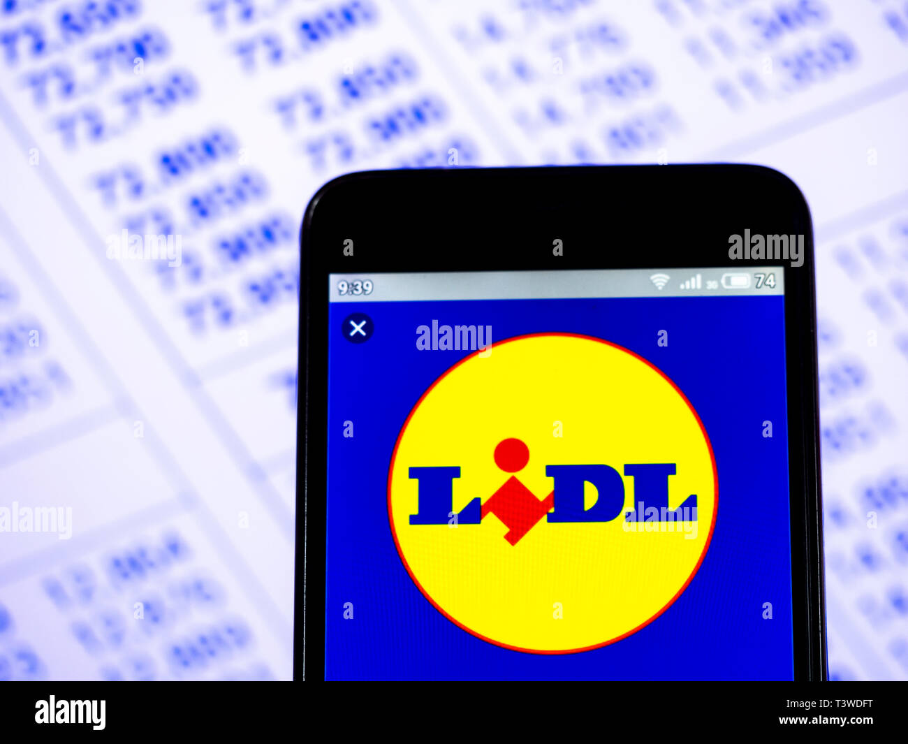 In this photo illustration a Lidl logo seen displayed on a smart phone ...