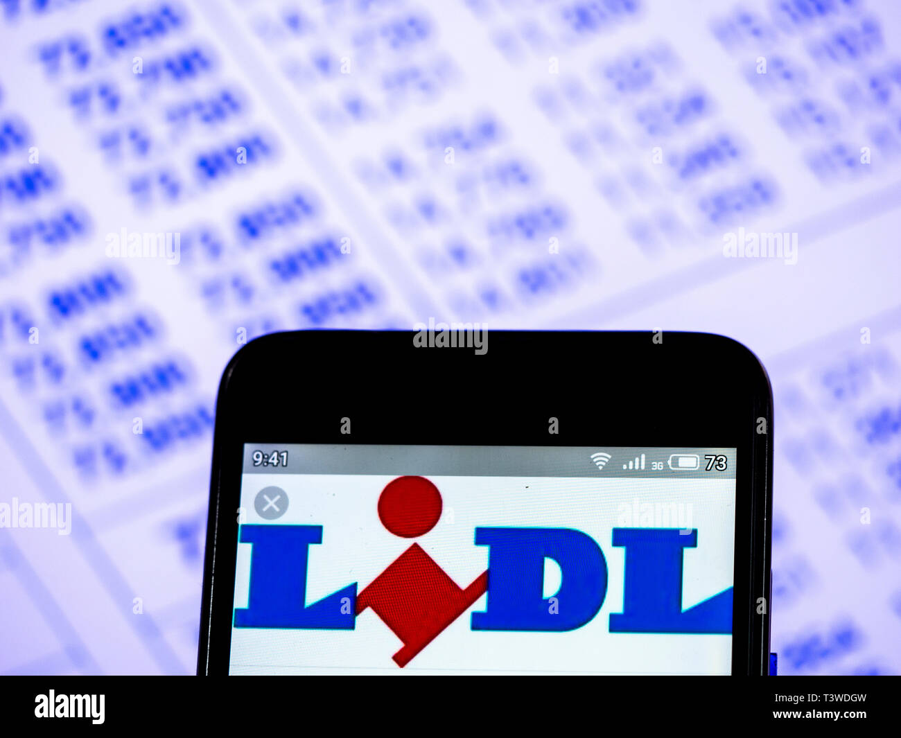 In this photo illustration a Lidl logo seen displayed on a smart phone ...