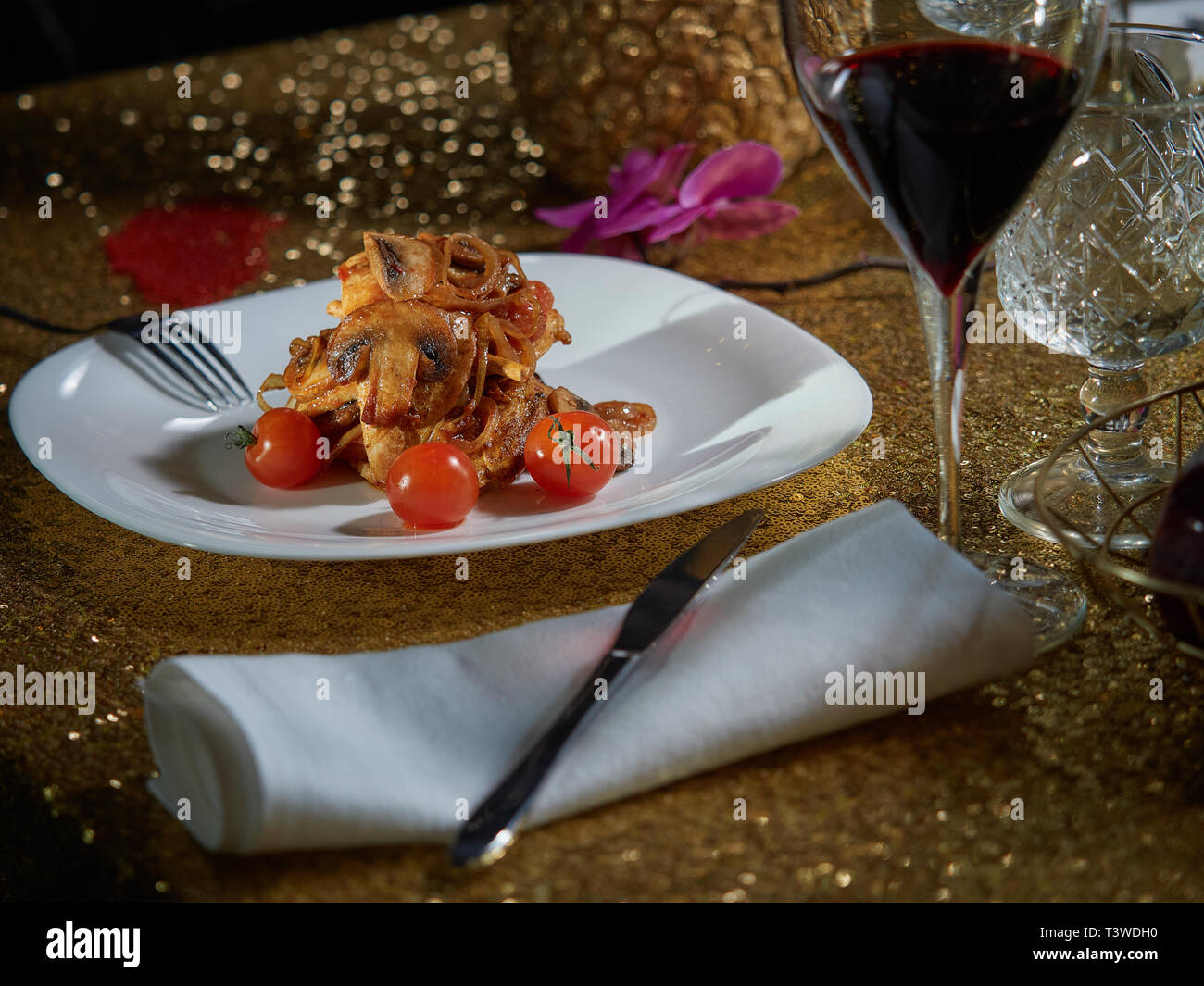 Small cuts of meat cooked along with fried mushrooms and onions are ...