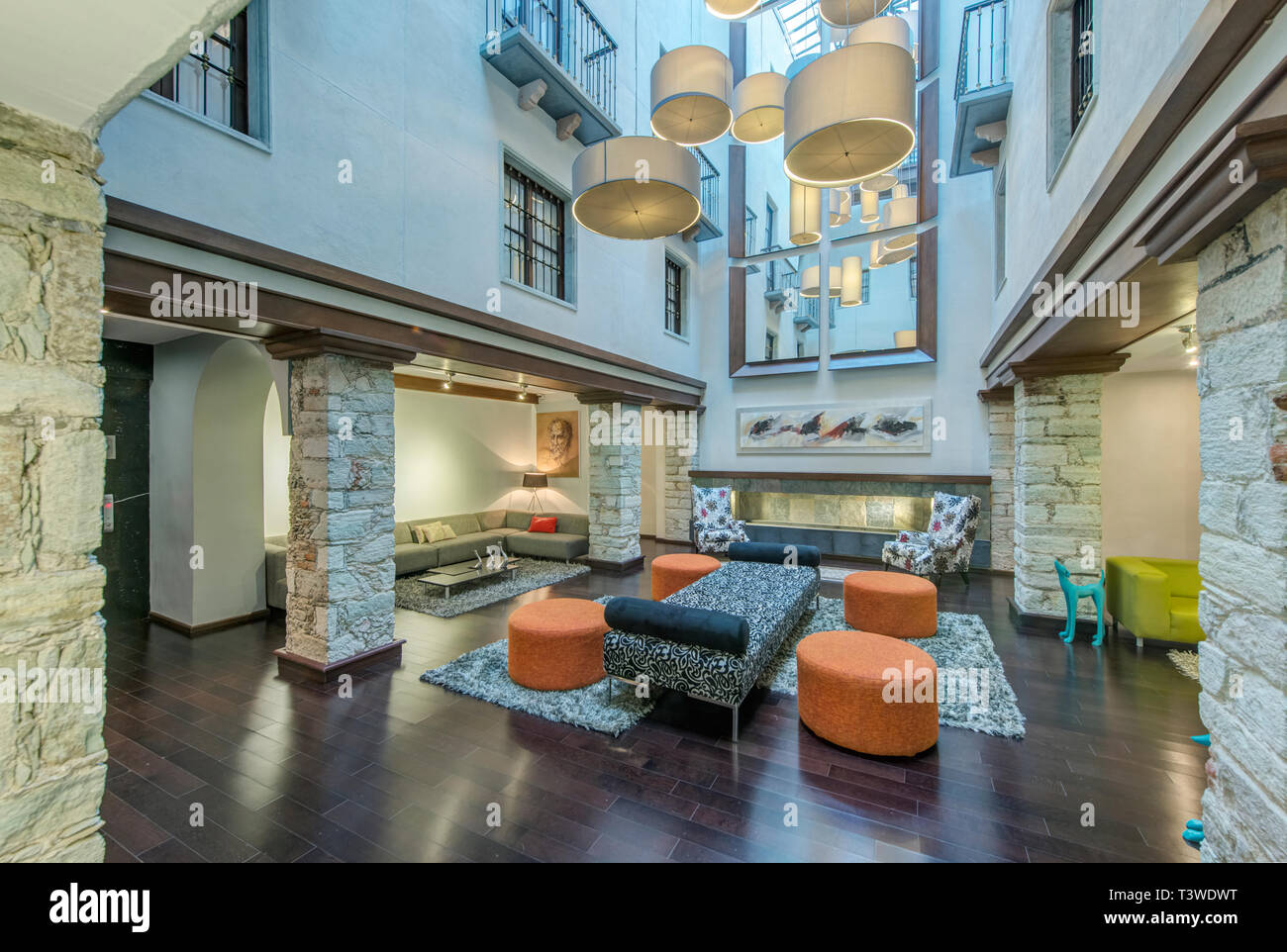 Seating and lighting in modern hotel lobby Stock Photo - Alamy