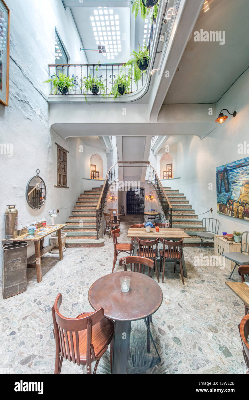 Balcony and staircase in traditional coffee shop Stock Photo - Alamy