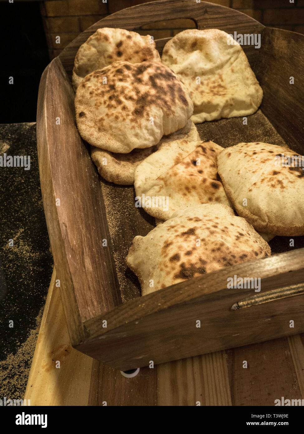homemade wholegrain pita bread on wooden basket, Traditional and ...
