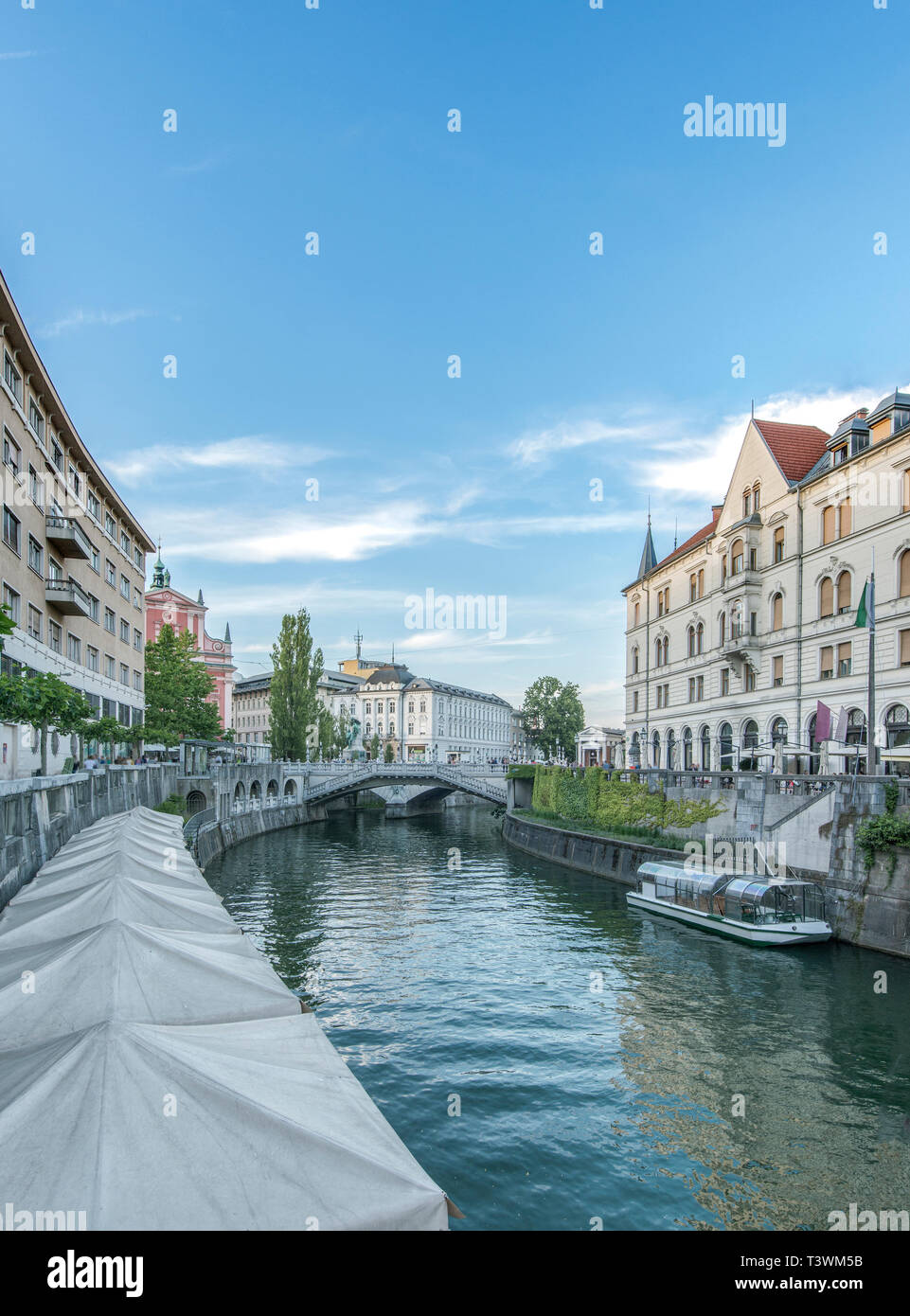Buildings and pedestrian bridge over urban canal, Ljubljana, Central ...