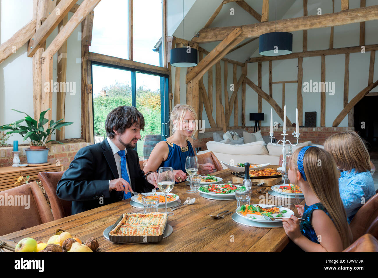 Family enjoying meal caucasian indoor hi-res stock photography and ...