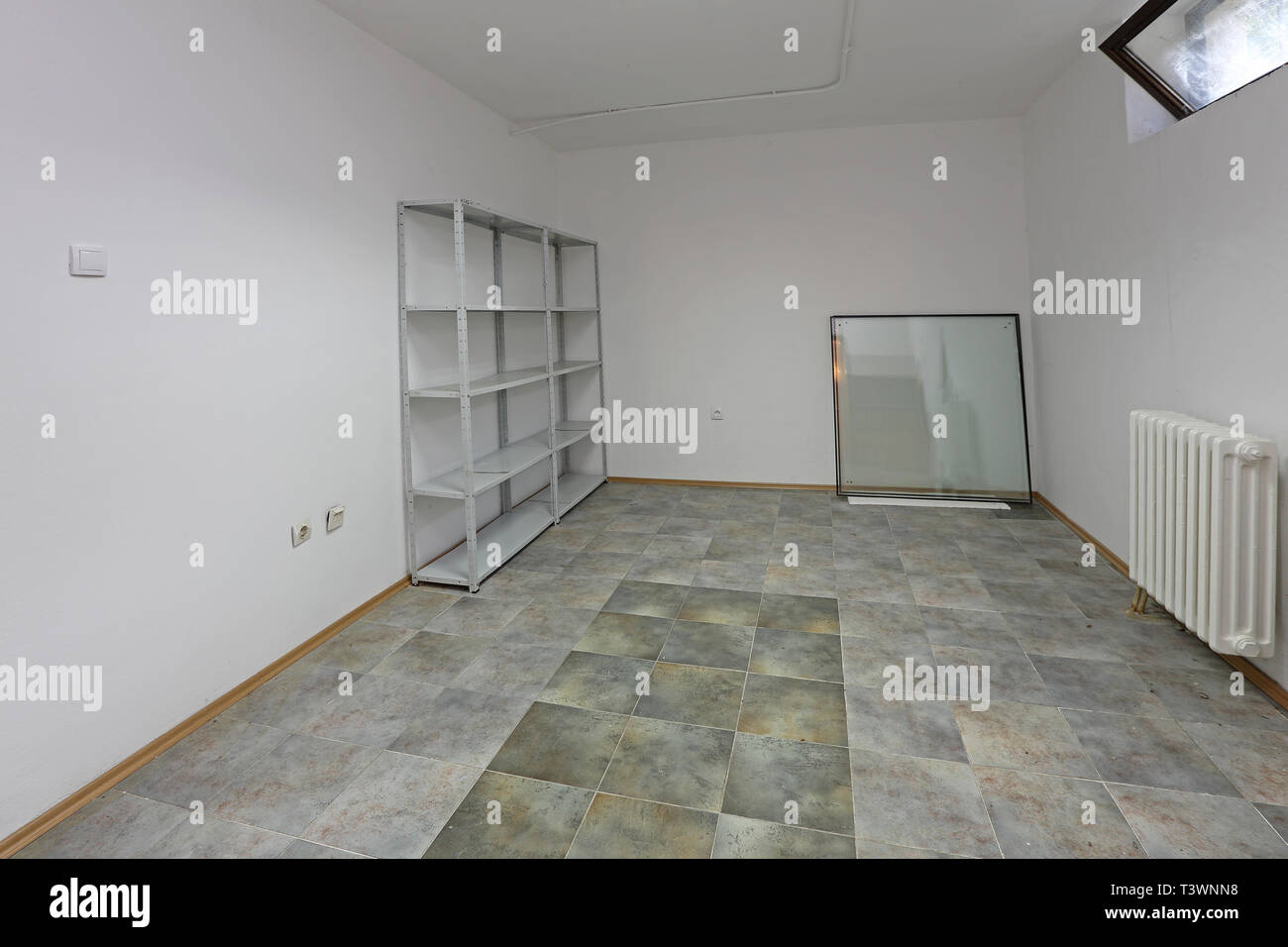 Empty Wall Shelf in Storage Room Stock Photo - Alamy
