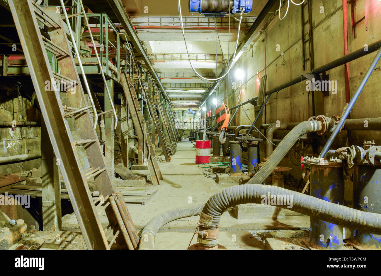 Basement of a water pumping station. Abandoned post-apocalyptic view of ...