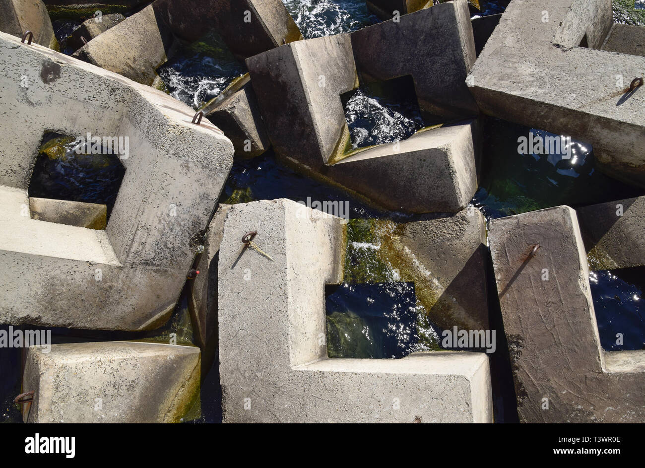 Breakwater blocks in the port. Breakwater of the rectangular stone ...