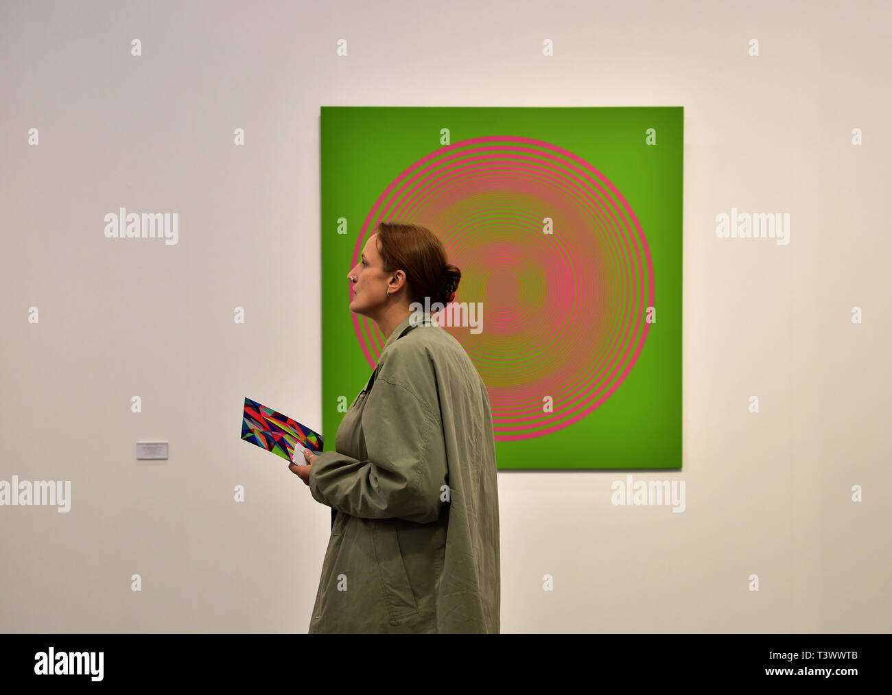 Cologne, Germany. 11th Apr, 2019. A woman visits the Art Cologne 2019 ...