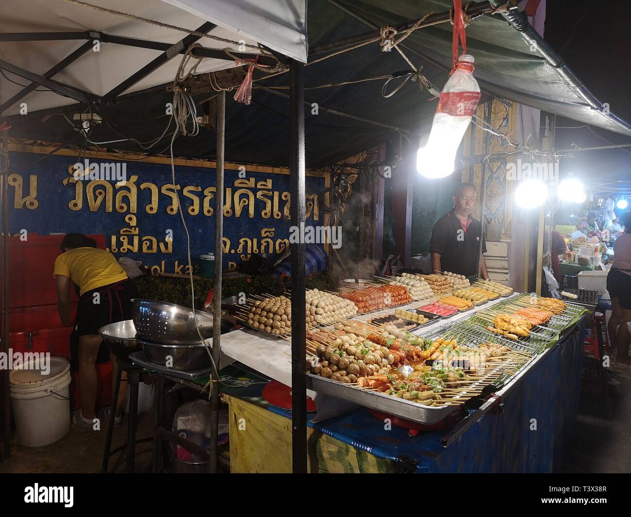 05 March 2019, Thailand, Karon Beach: A stand with various Sate skewers ...