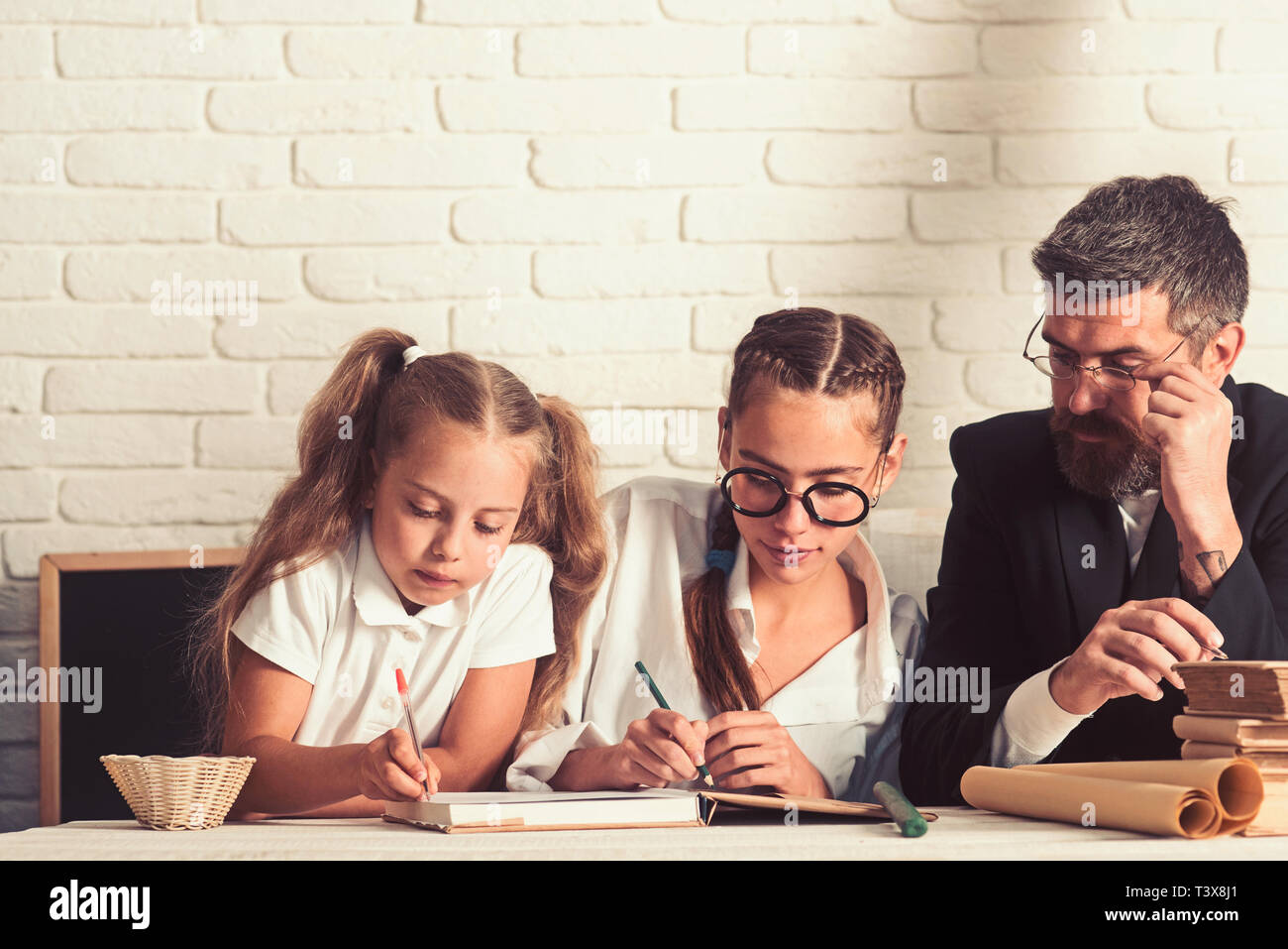 Father helps children to study at home. Back to school and home ...
