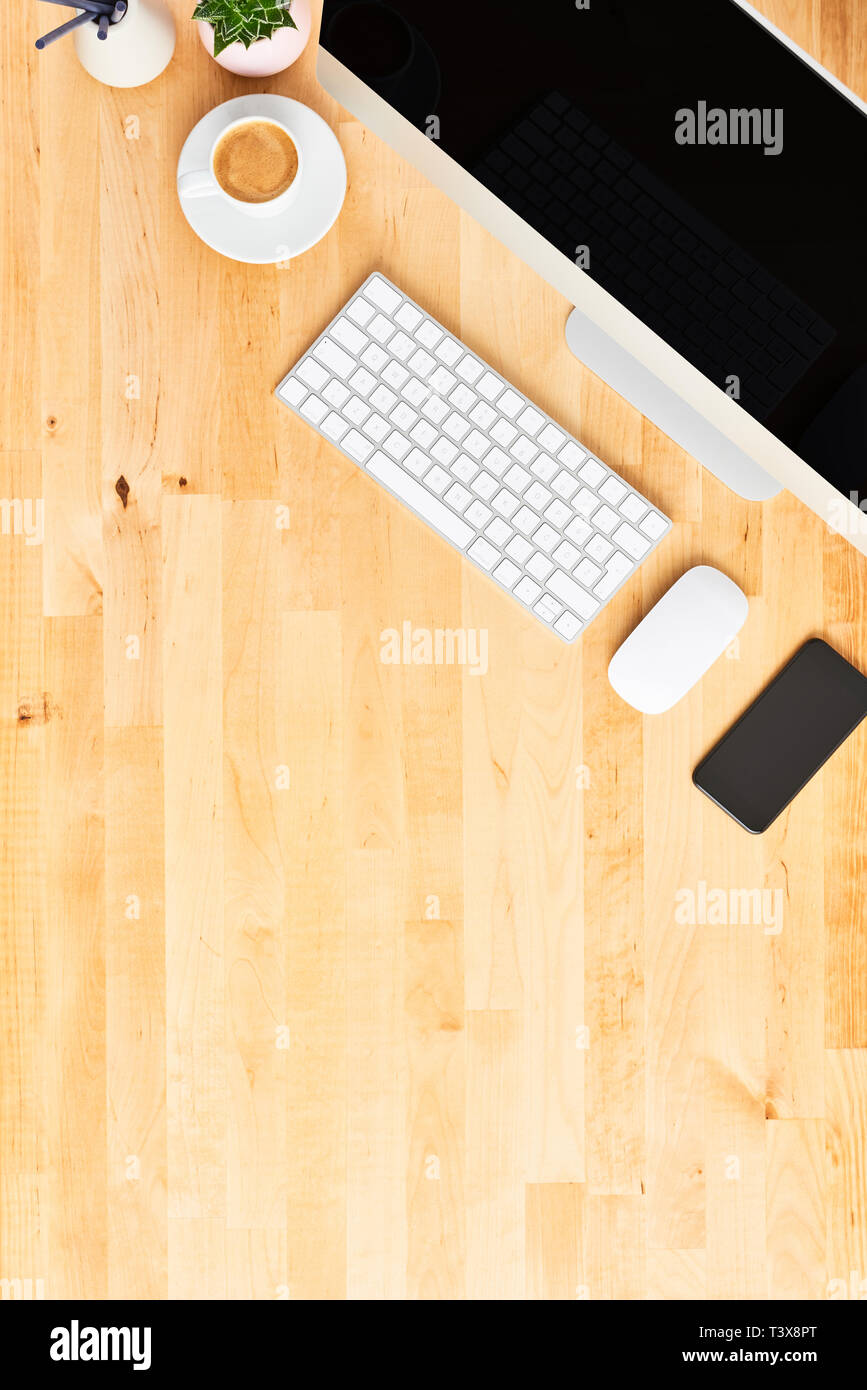 Desktop computer. Top view of wooden office desk with large desktop ...