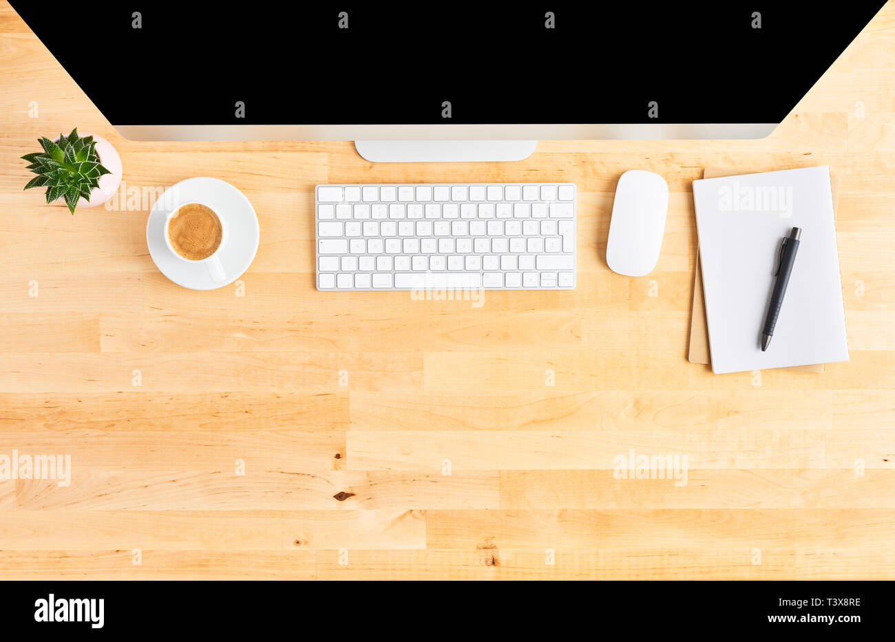Modern desktop computer. Top view of wooden office desk with large ...