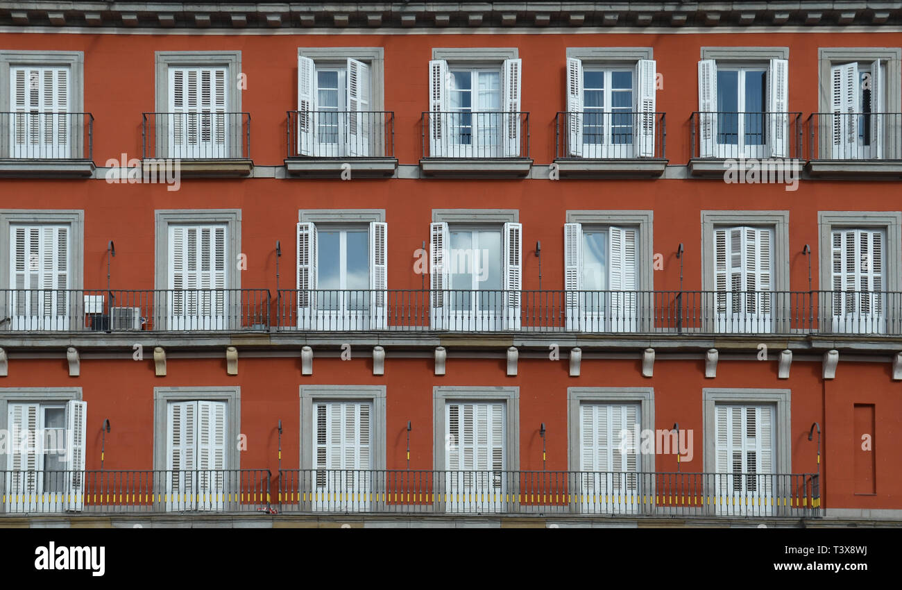 Windows and balconies on the red building in Plaza Mayor, Madrid Spain ...
